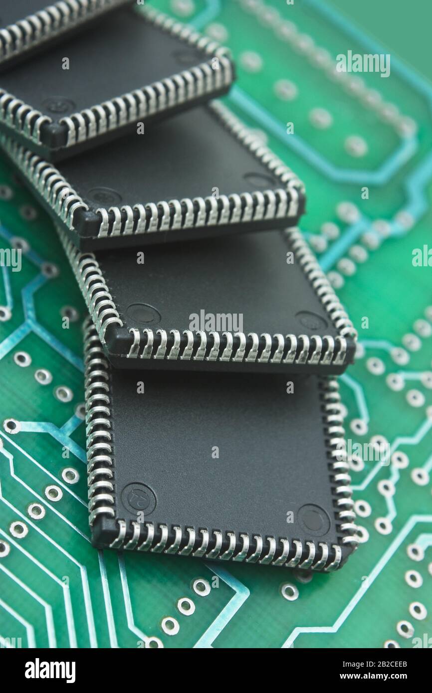 pile of microchips on a printed circuit board Stock Photo - Alamy