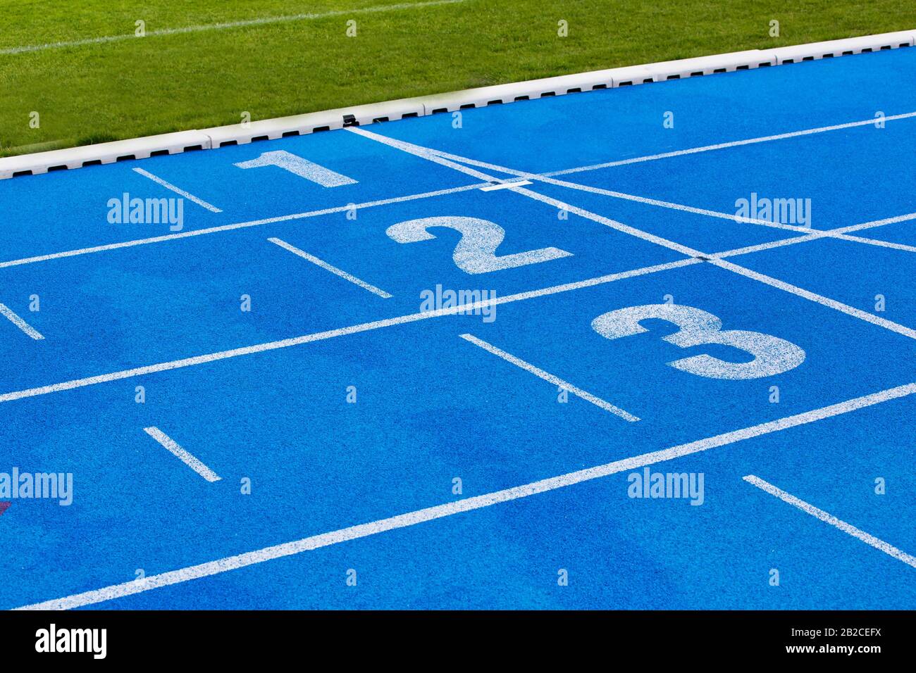 Photo of blue stadium tracks Stock Photo - Alamy