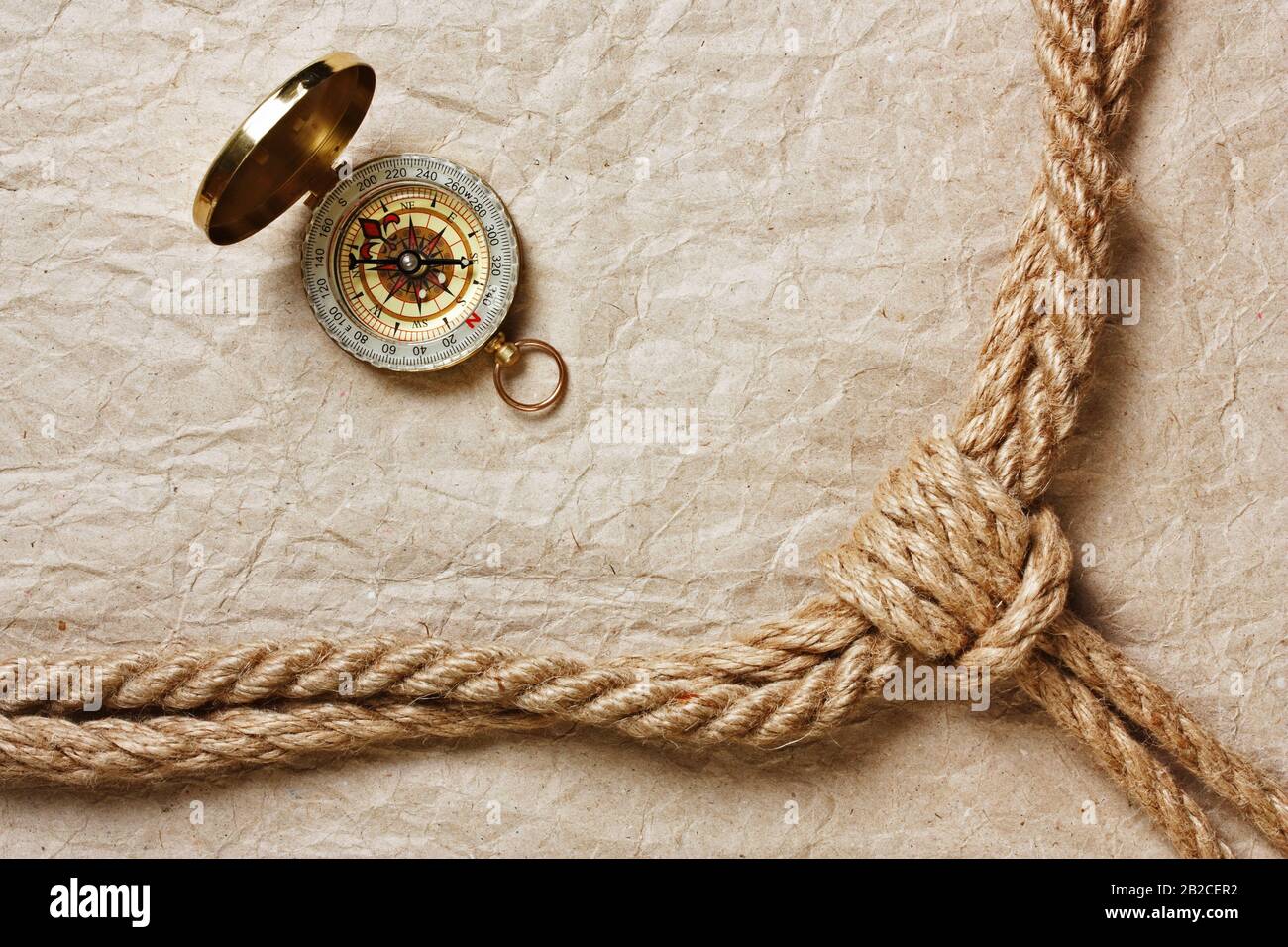 compass, old paper and rope, still-life Stock Photo - Alamy