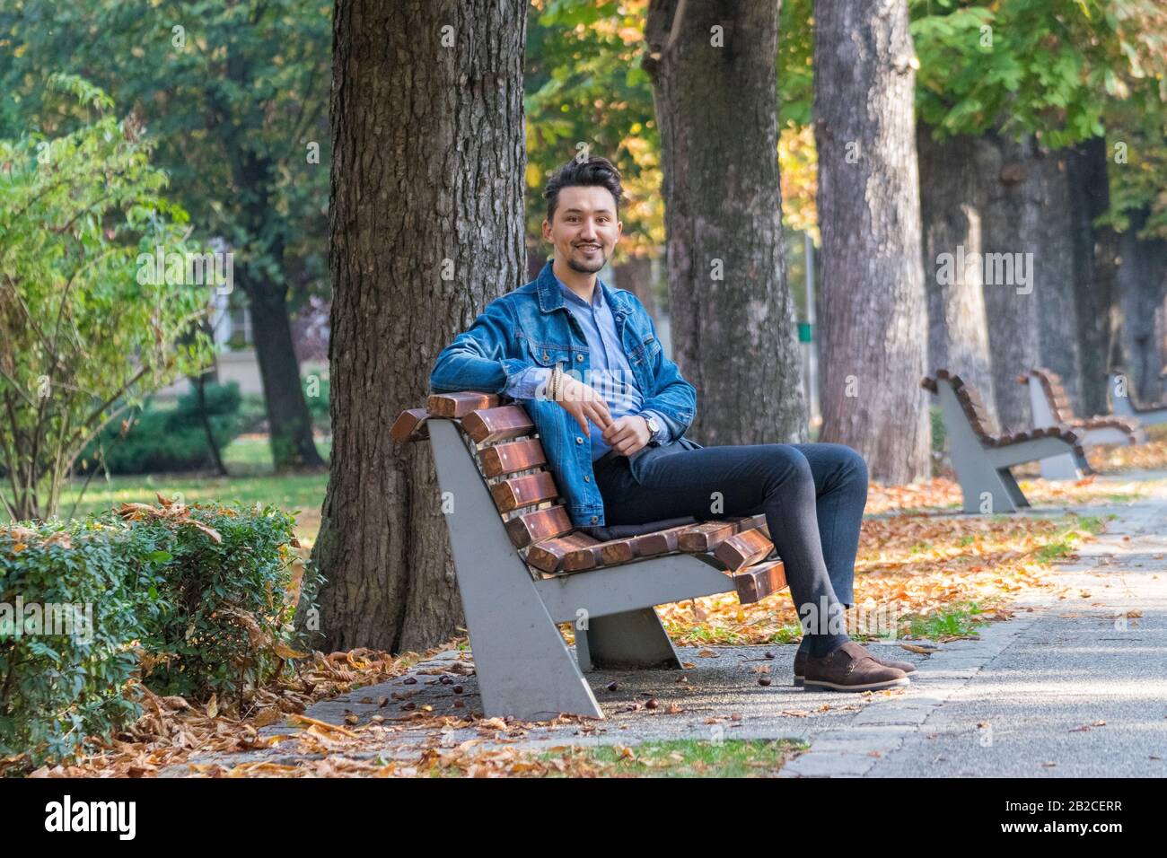 Handsome young man looking at the camera. Portrait of laughing ...