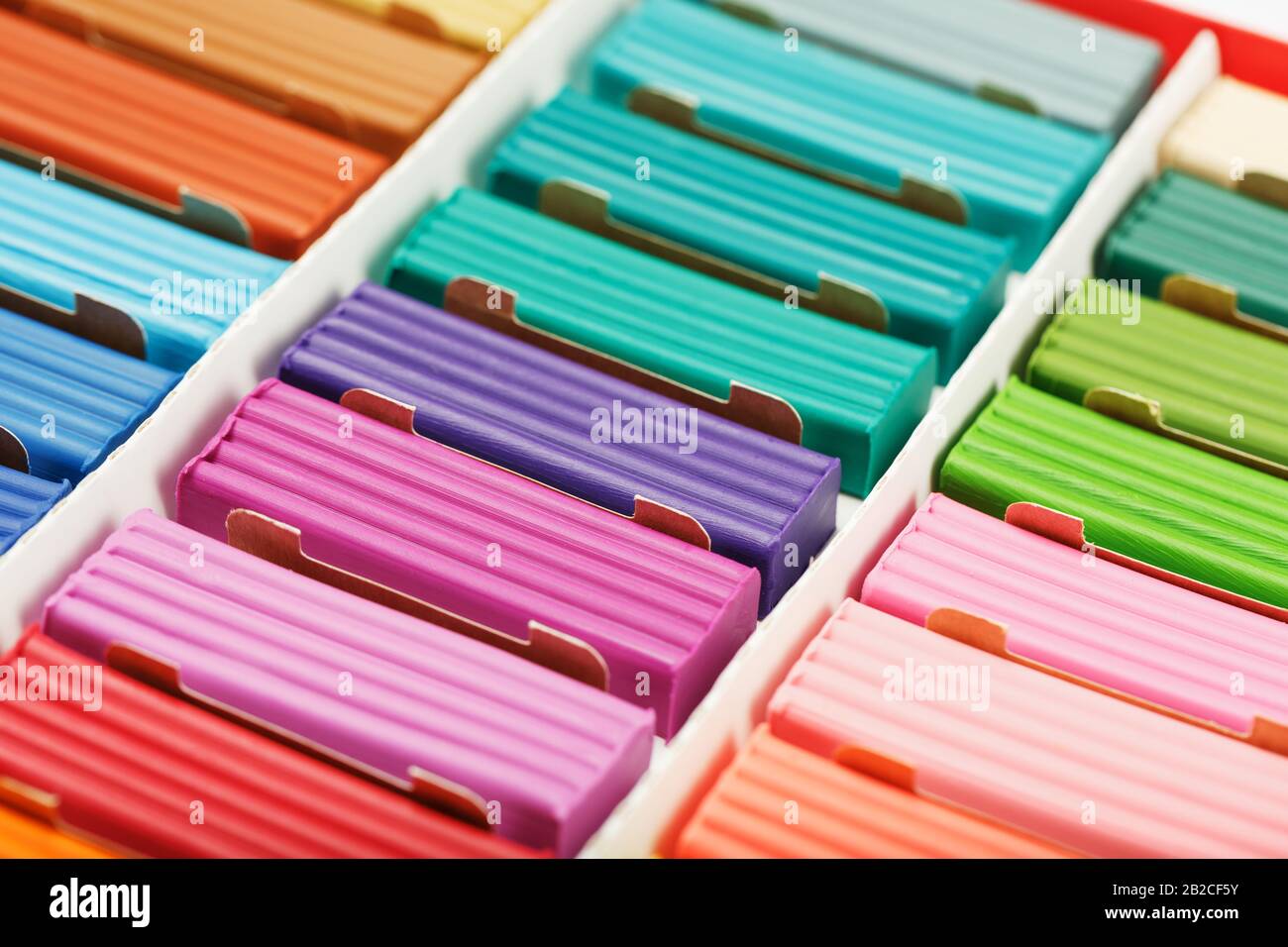 Plasticine in a box of multi-colored pieces in full screen, material ...