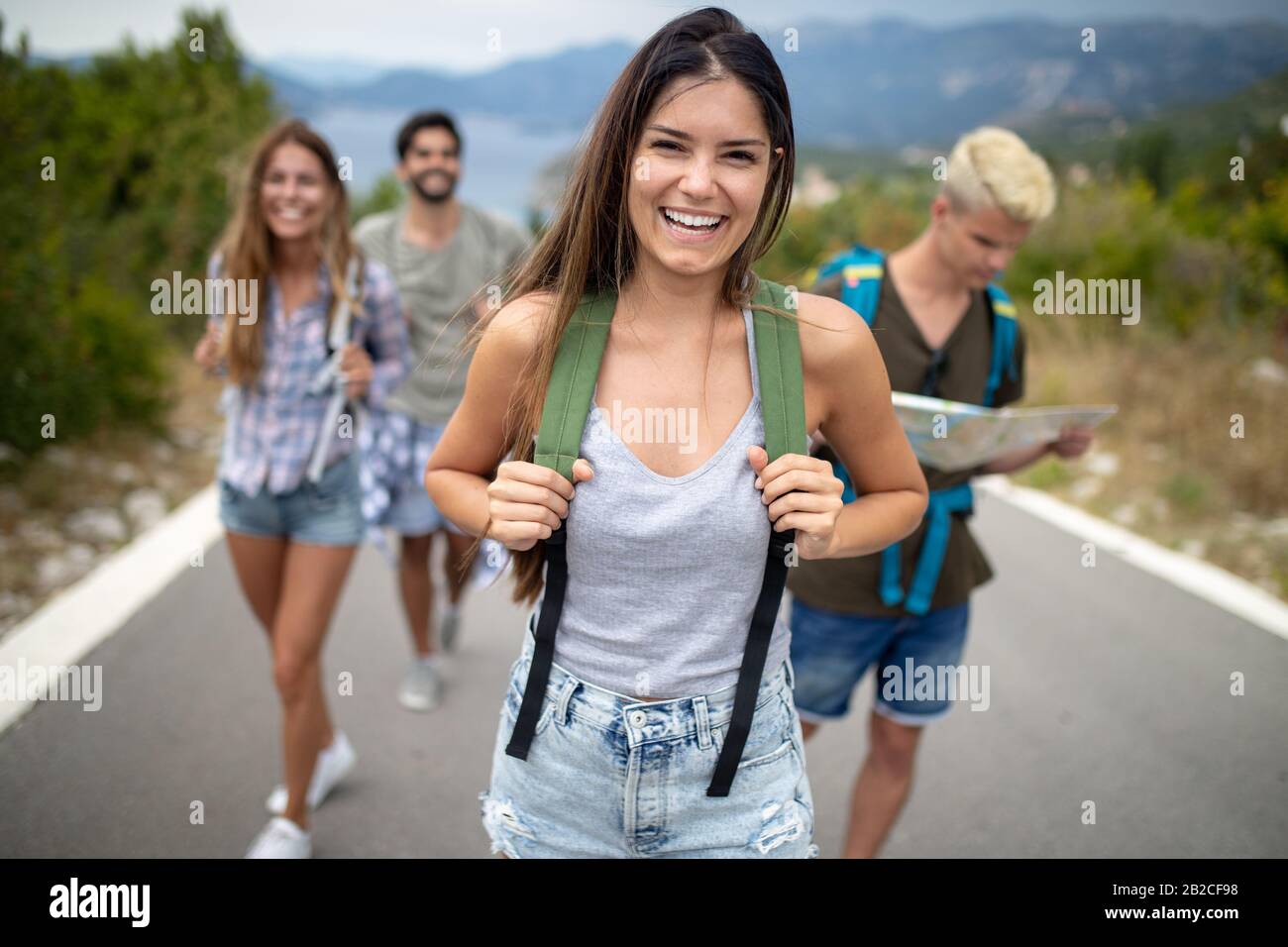 Adventure, travel, tourism and people concept - group of smiling ...