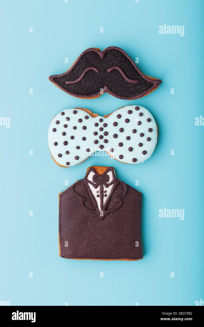 Glazed gingerbread in the form of a mustache, butterfly and tuxedo, men ...