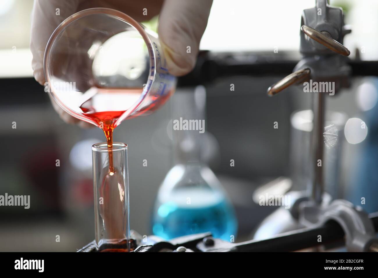 Chemical experiments with colored liquid in lab Stock Photo - Alamy