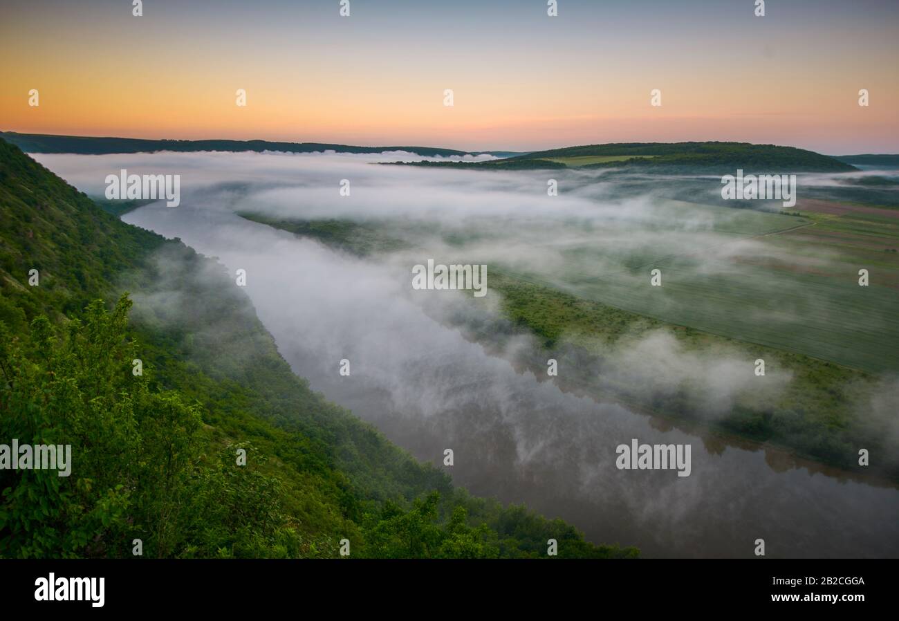 Top view of Dnestr (Dniester) river at sunrise. River is covered with ...