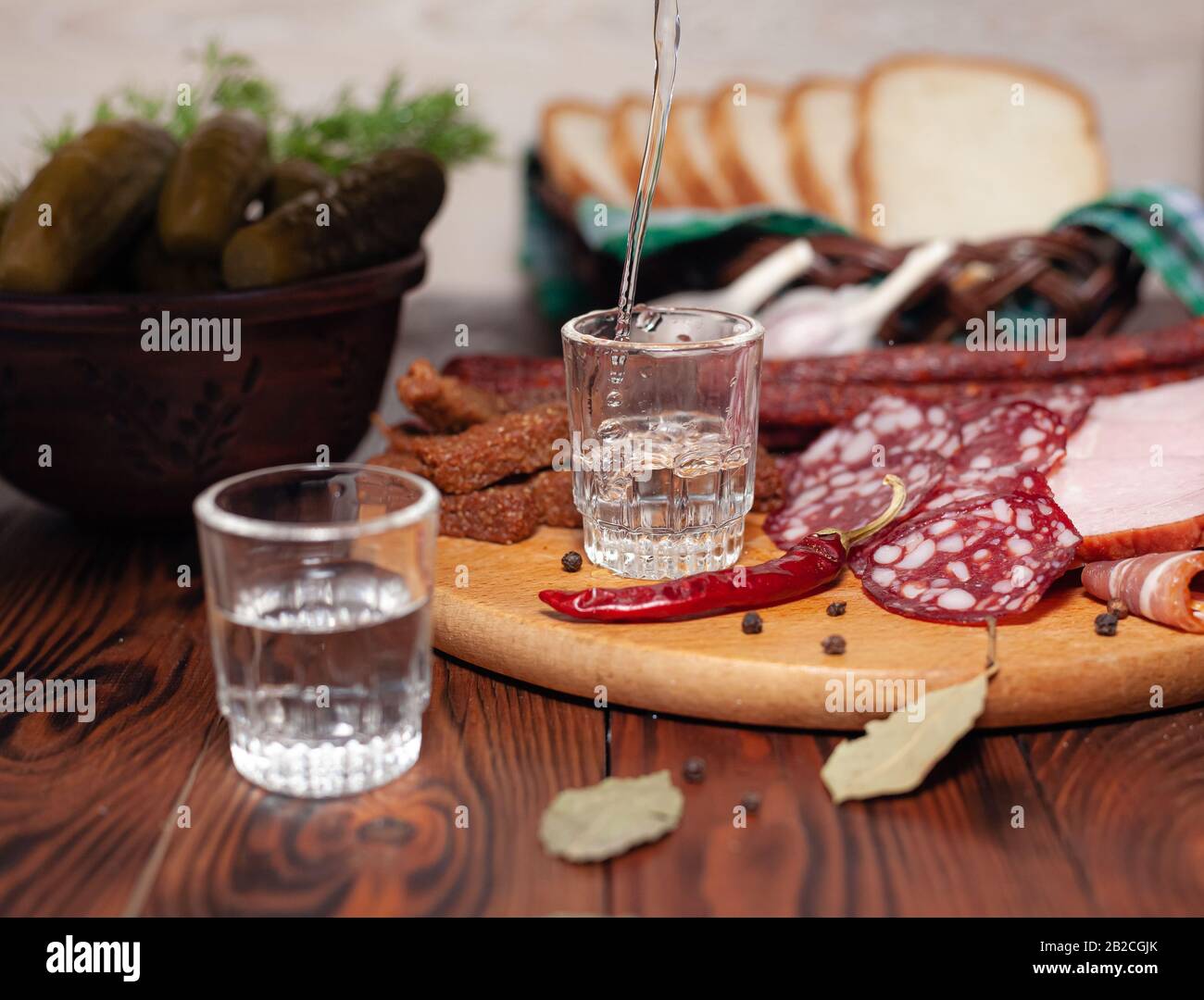 Traditional drink vodka in glasses, with a snack in the form of cold ...