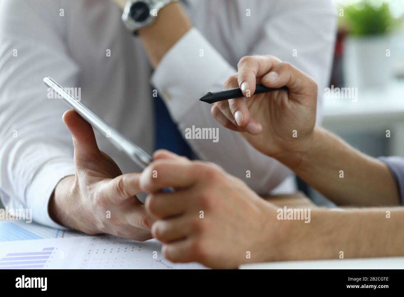 Men in workplace and sign an electronic document Stock Photo - Alamy