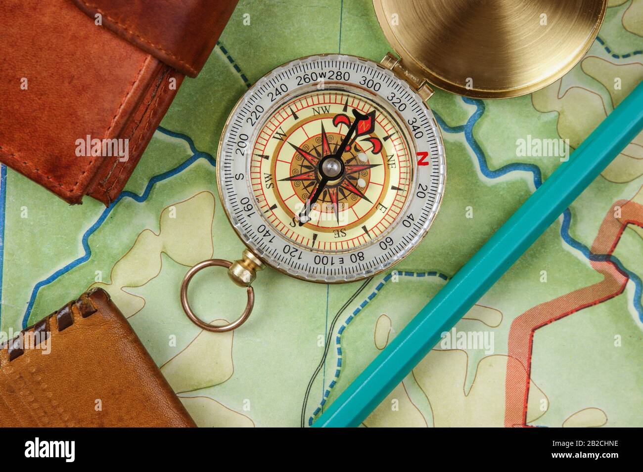 compass wallet and passport on the old map Stock Photo - Alamy
