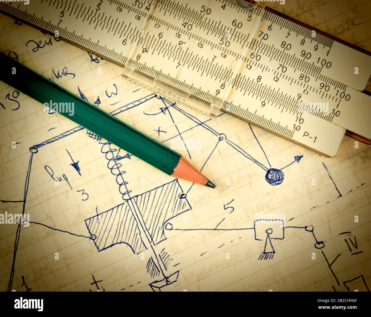 pencil and a slide rule on the old page with the calculations in ...