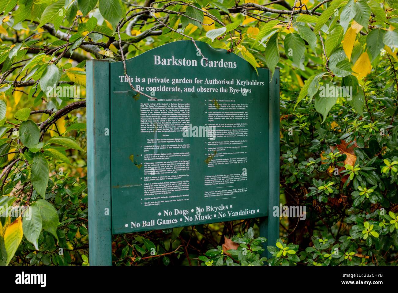 Sign indicating bye-laws and rules of garden, inside communal garden ...