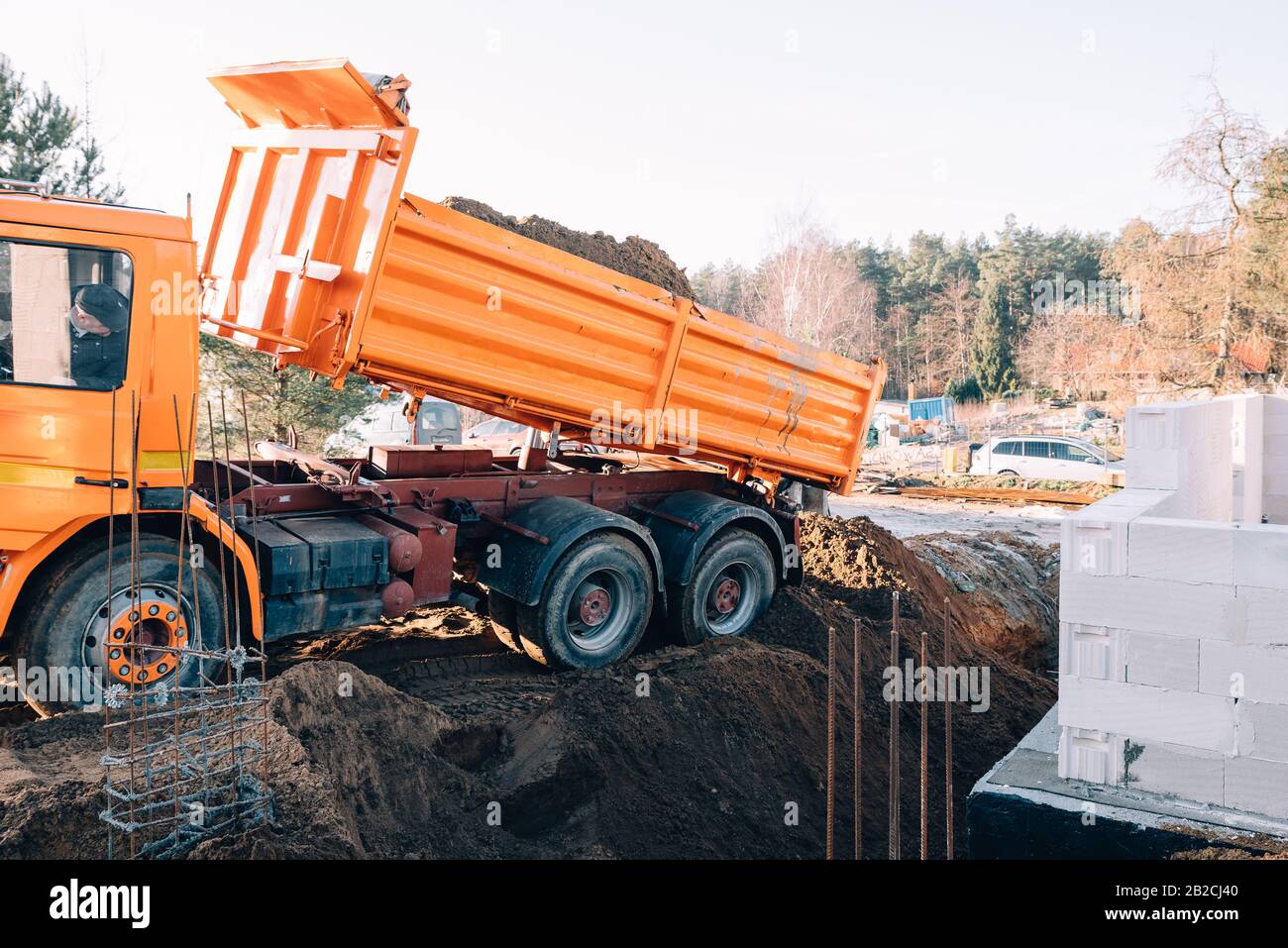 dump truck with excavator on site Stock Photo - Alamy