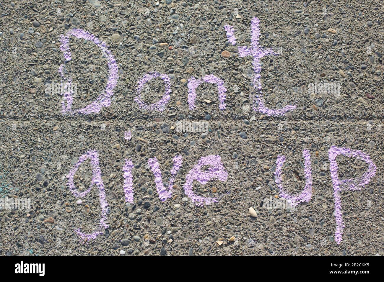 Sign of encouragement handwritten on a sidewalk Stock Photo - Alamy