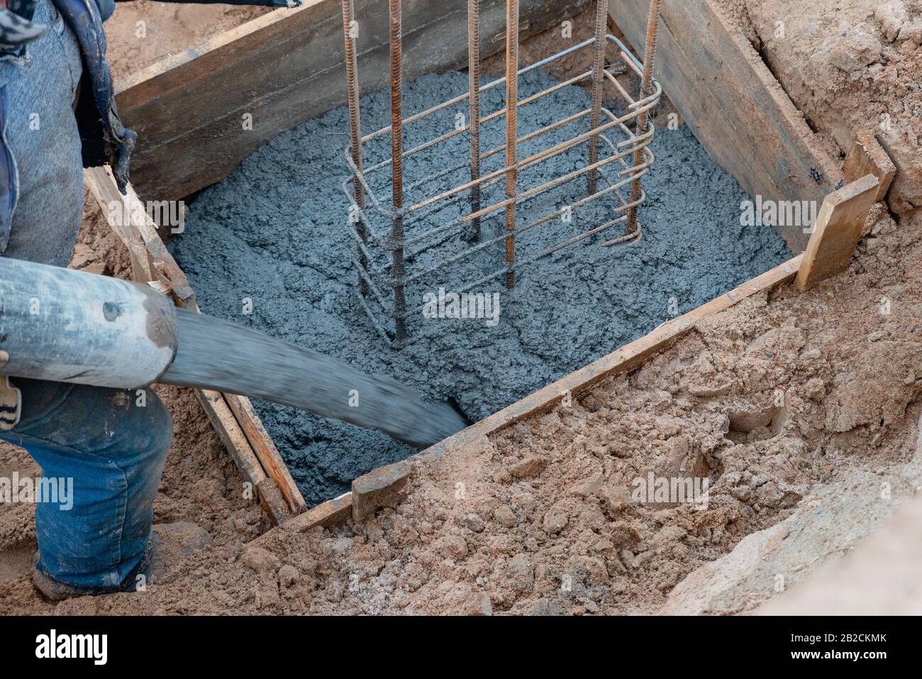 Pouring the ceiling with concrete from pump pipe Stock Photo - Alamy