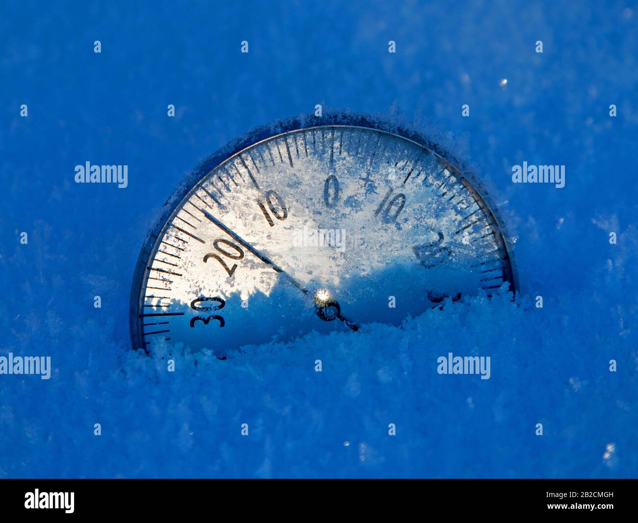 Winter and the cold keep their grip. An outdoor thermometer shows minus ...