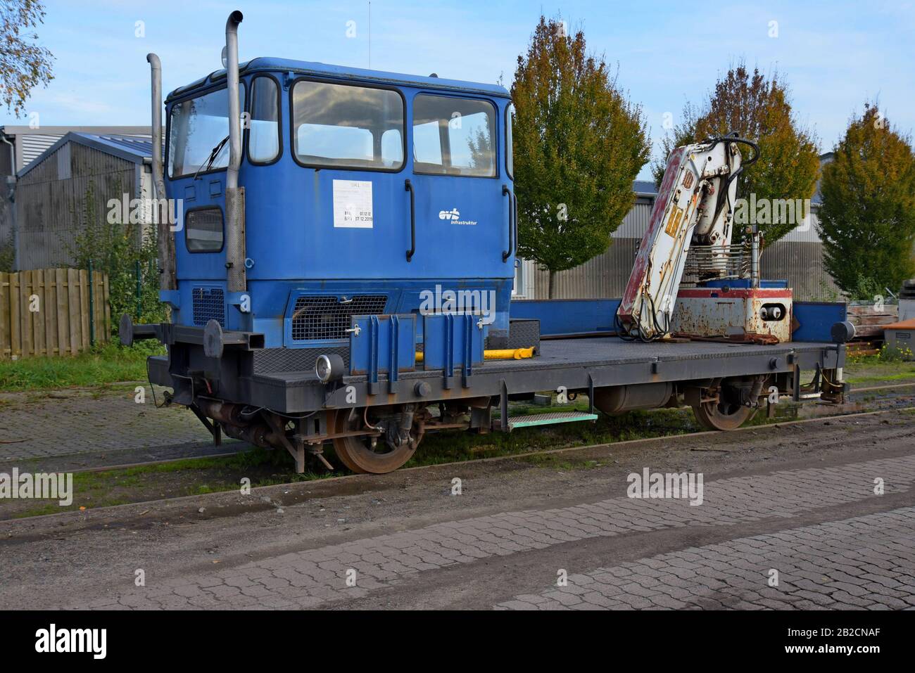 A track and permanent way maintenace vehicle with onboard crane in the ...