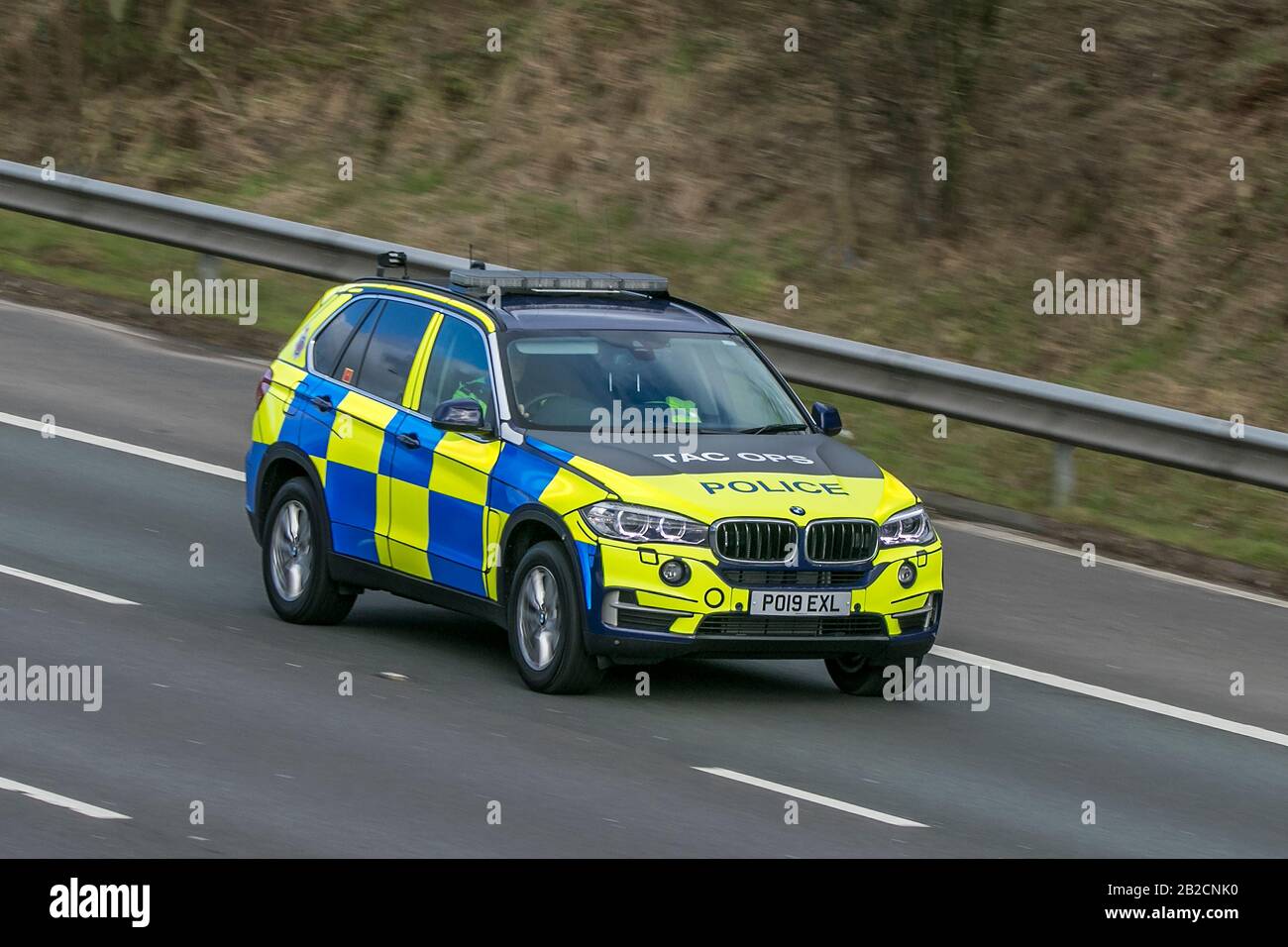 Police car emergency services vehicles driving on the M6 motorway near ...