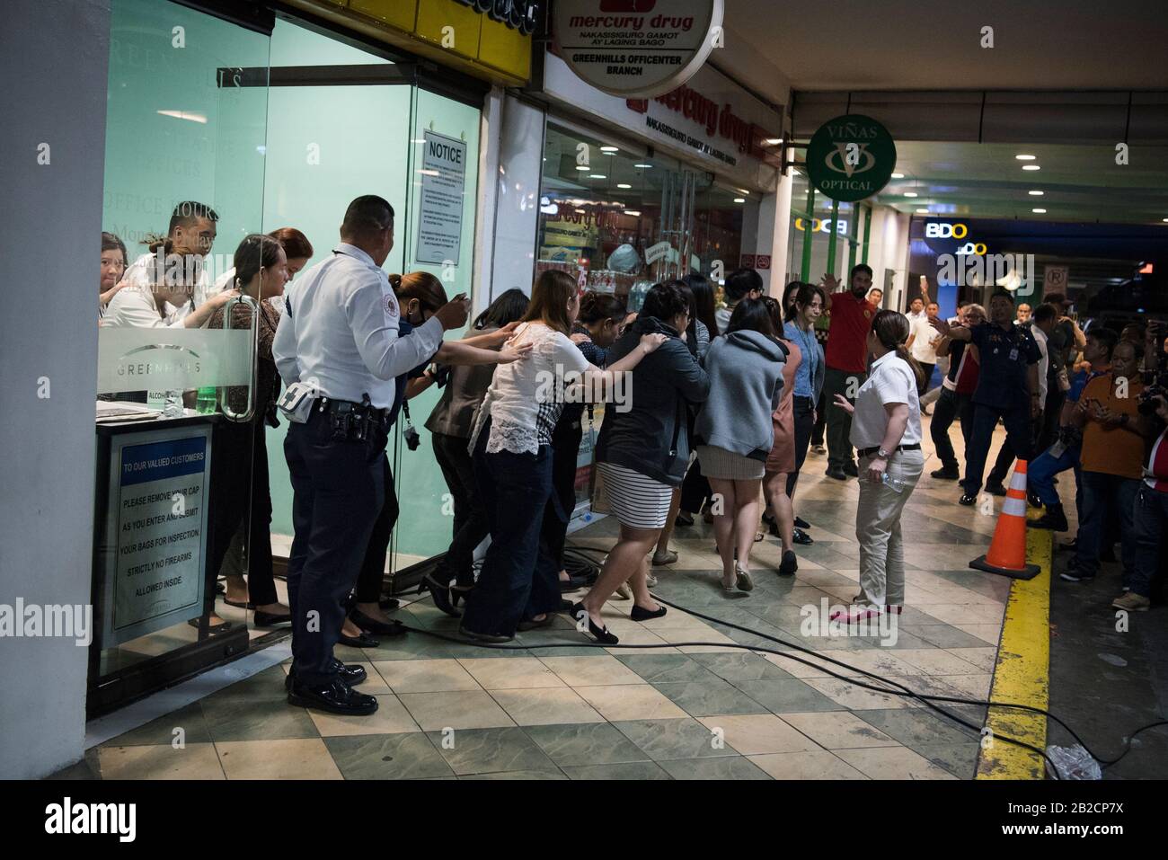 Hostages are being led out of V shopping mall alongside hostage taker Archie Paray.Police ...