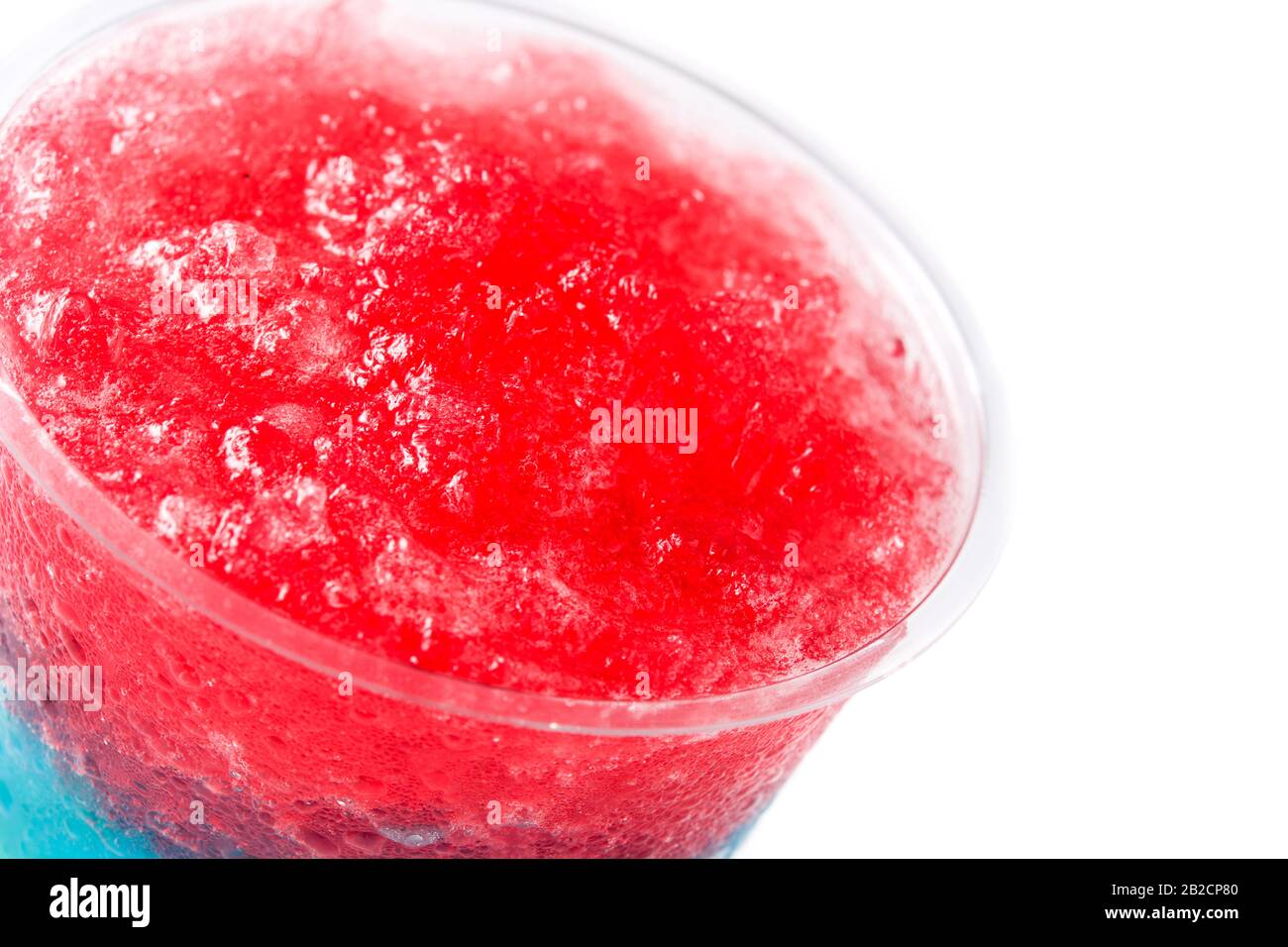 Colorful slushie of differents flavors with straw in plastic cup ...