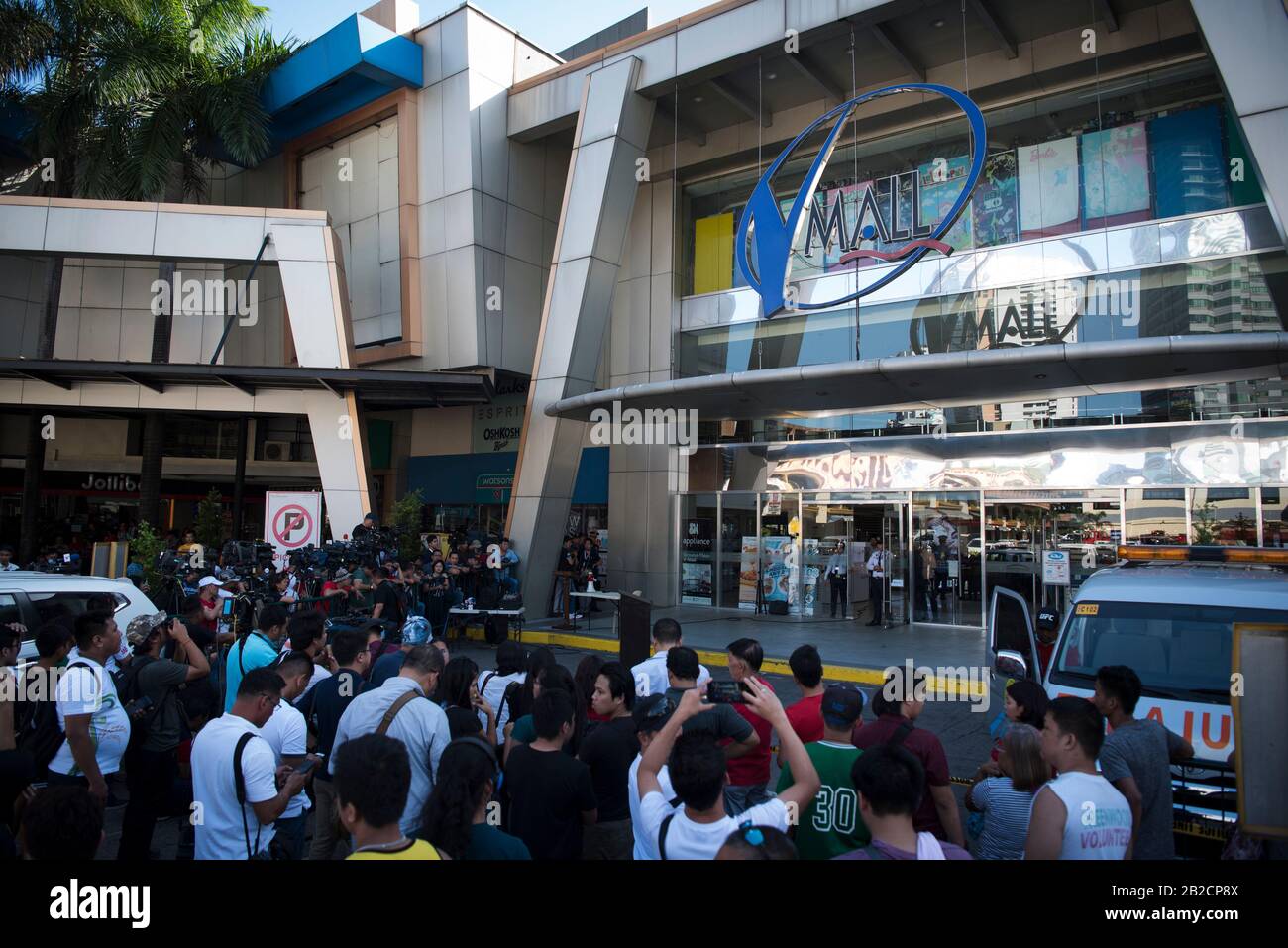 Members of the press gather outside V shopping mall.Police surrounded a ...