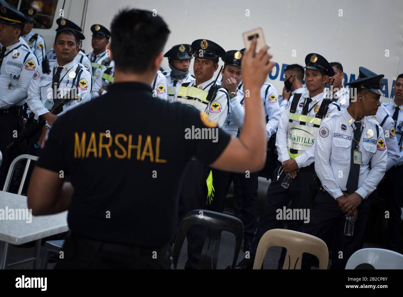 Security guards gather outside V shopping mall.Police surrounded a ...
