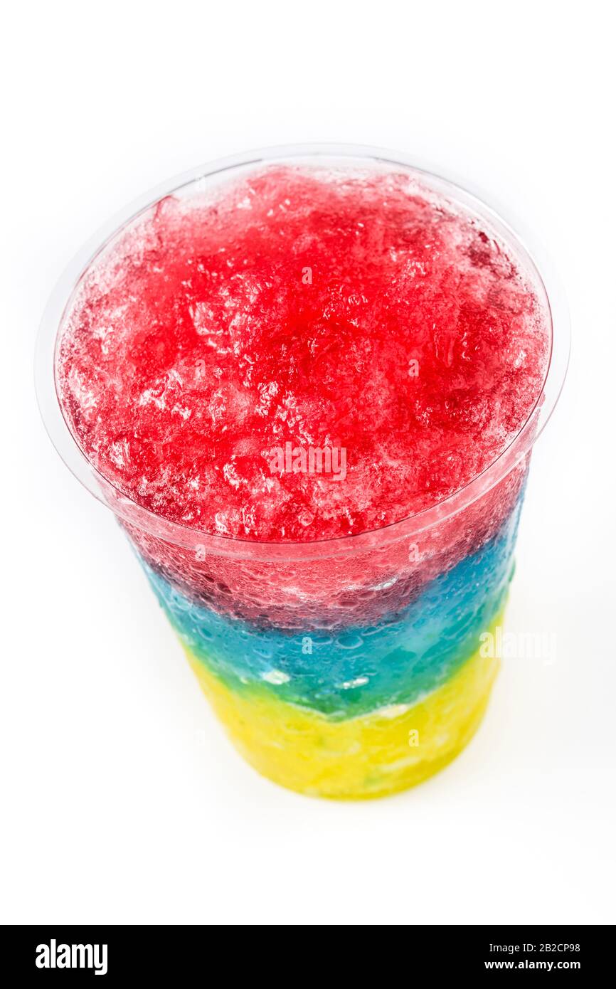 Colorful slushie of differents flavors with straw in plastic cup ...