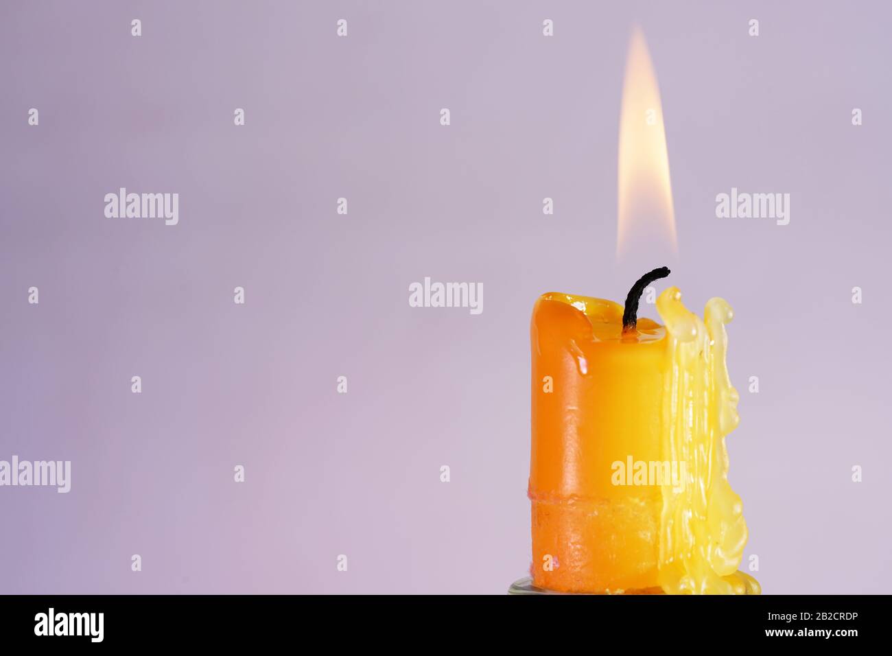 Candle with smoke and flame photographed in the studio with color foils ...