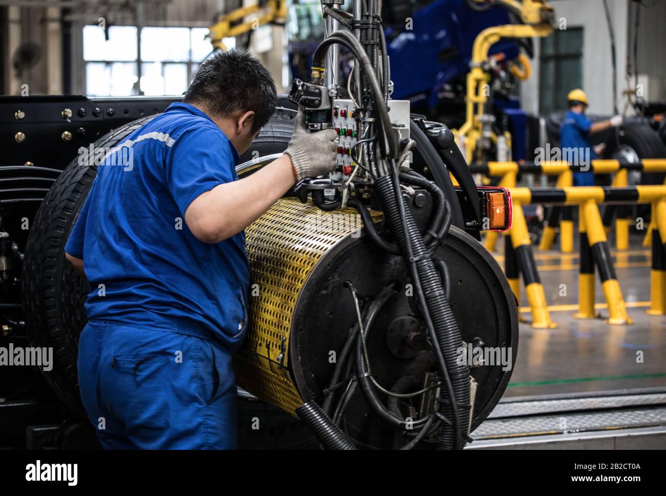 Workers in machinery factory in China Stock Photo - Alamy