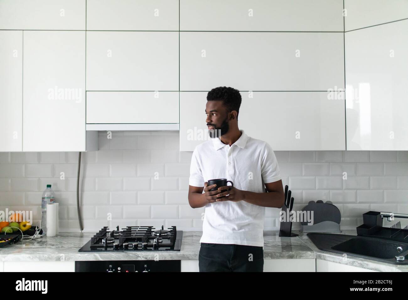 African American Man Eating Breakfast And Reading Newspaper Stock Photo ...