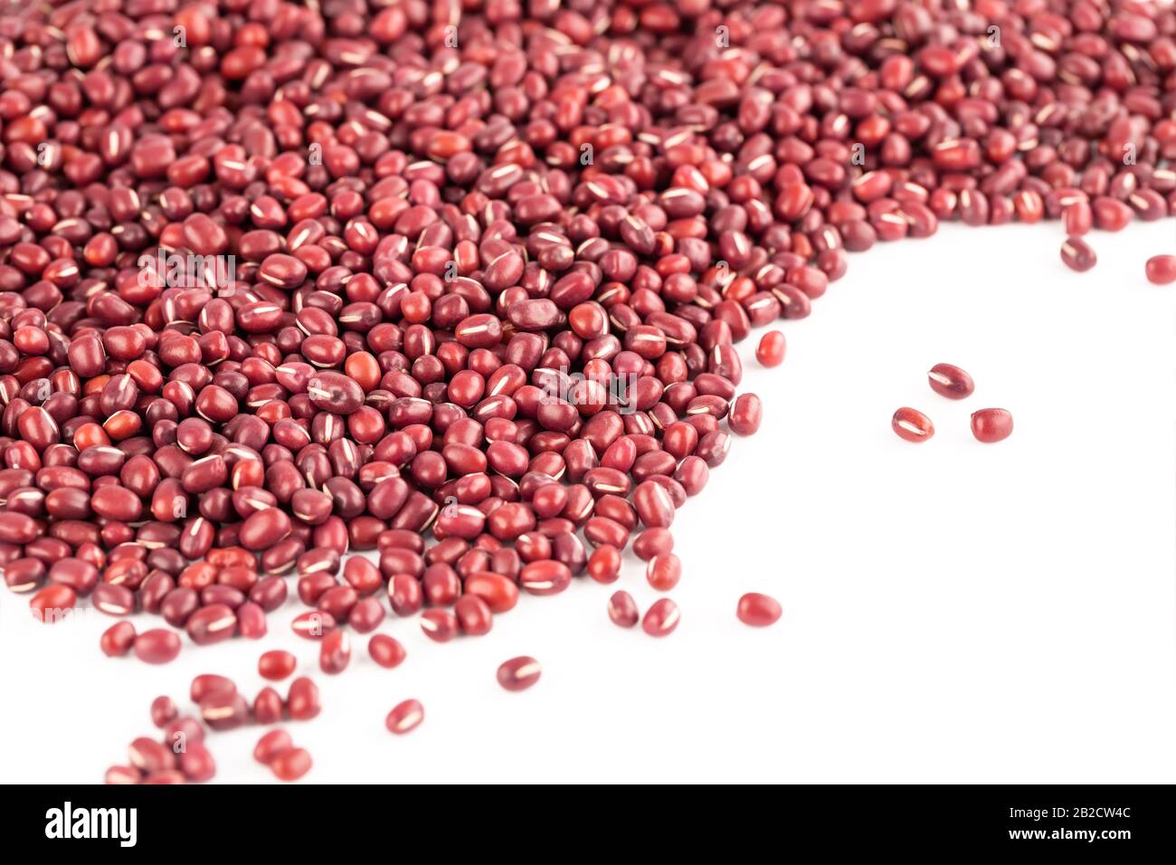 Red azuki beans on a white background Stock Photo - Alamy