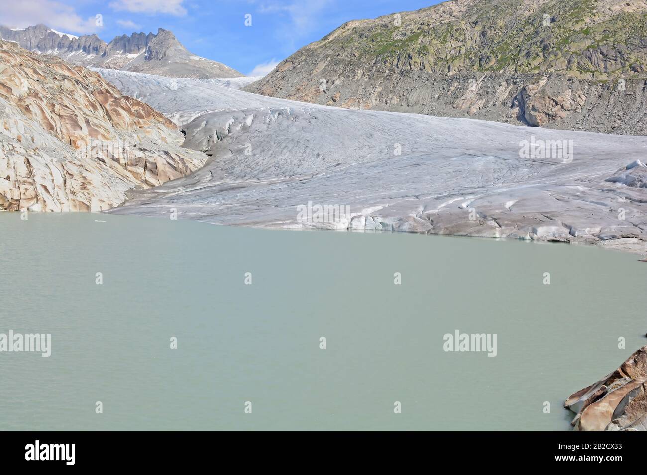 The Rhone Glacier and the glacial lake which marks the birth of the ...