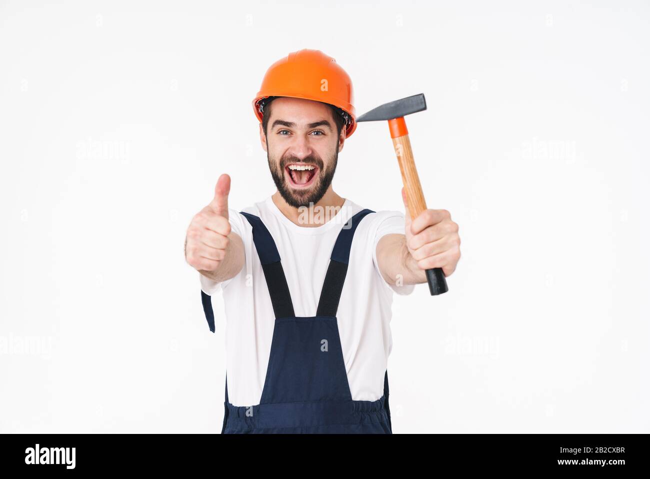 Image of happy positive young man builder in helmet posing isolated ...