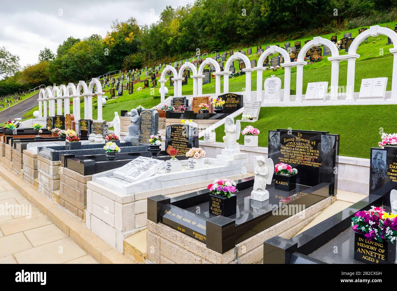 Memorial arches and graves, Bryntaf Cemetery, Aberfan Cemetery, Glamorgan, Wales, resting place ...