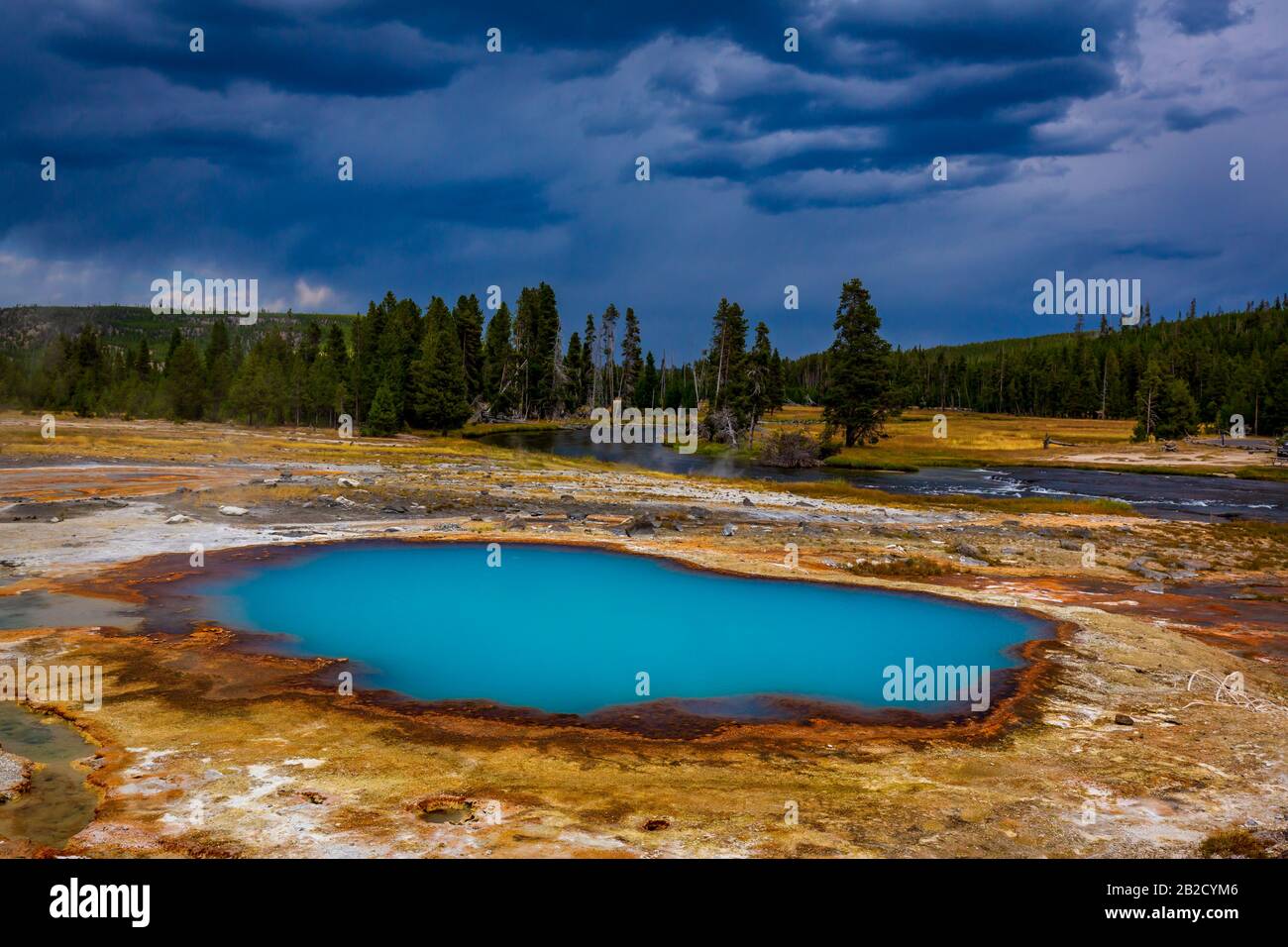 Black Opal Pool is an opalescent blue colored hot pool in Biscuit Basin ...