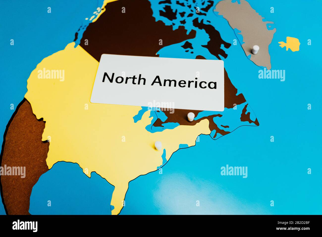 Montessori map of North America made of wood with text label in a ...