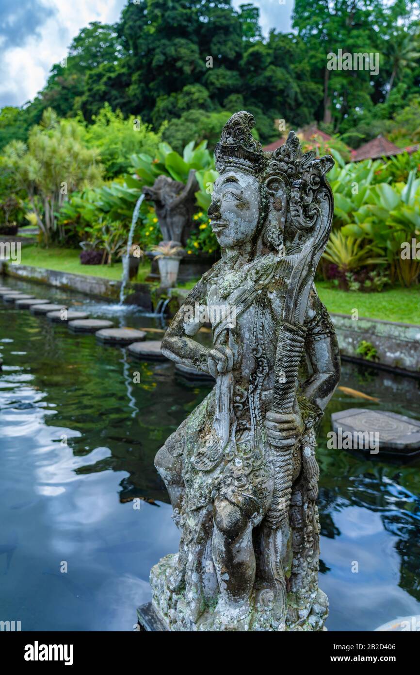 Statue at the Tirta Gangga palace in Bali Indonesia Stock Photo - Alamy