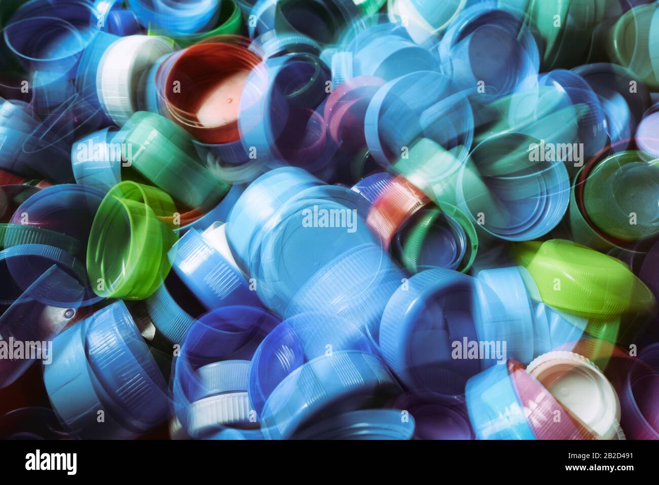 Various size and color plastic caps in recycling center Stock Photo - Alamy