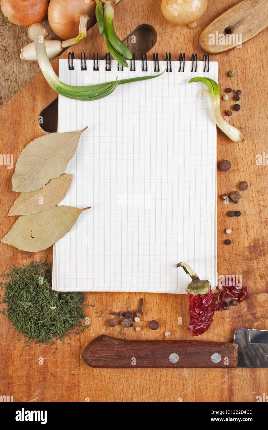 notebook for cooking recipes and spices on a wooden table Stock Photo ...