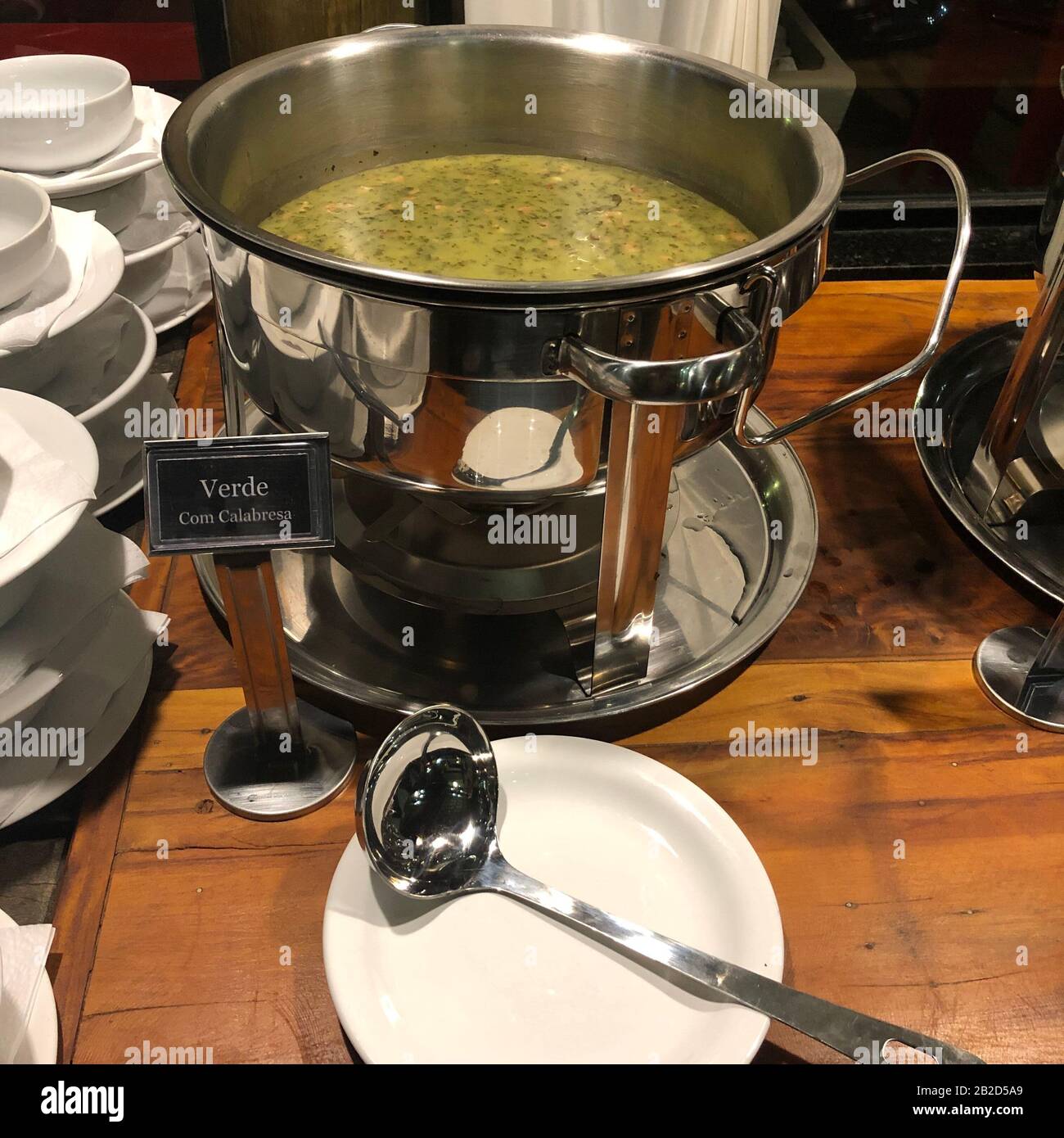 Photo of soup being served inside a restaurant. Color image, inside ...