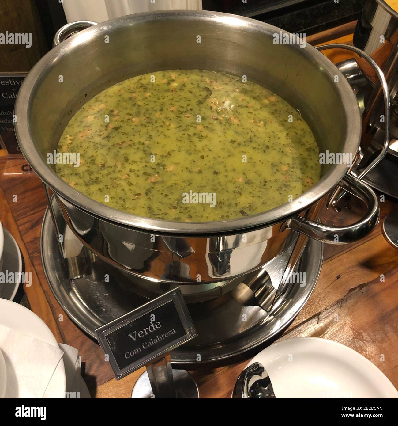 Photo of soup being served inside a restaurant. Color image, inside ...