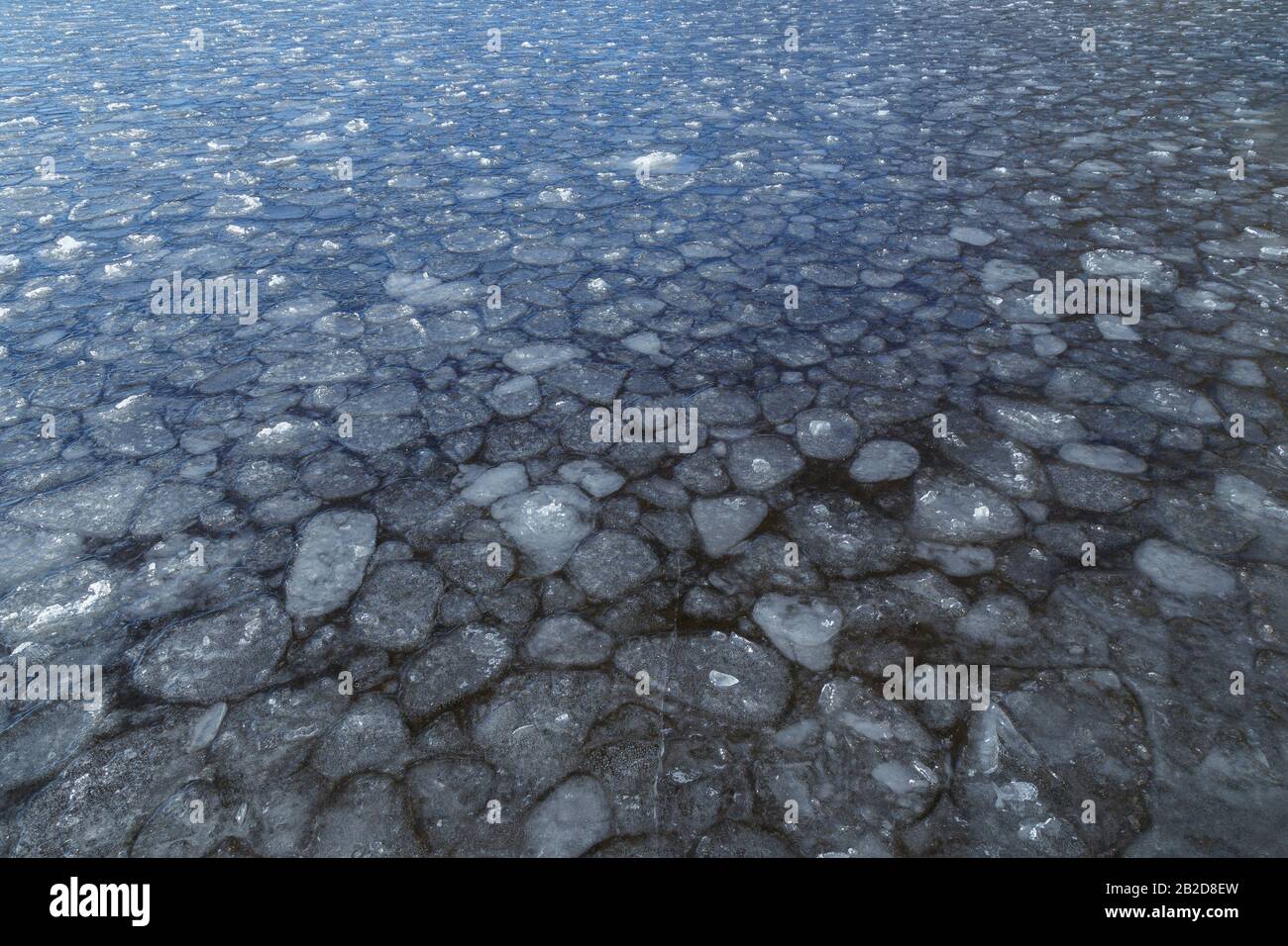 View of surface of a frozen lake in Finland in the winter Stock Photo ...