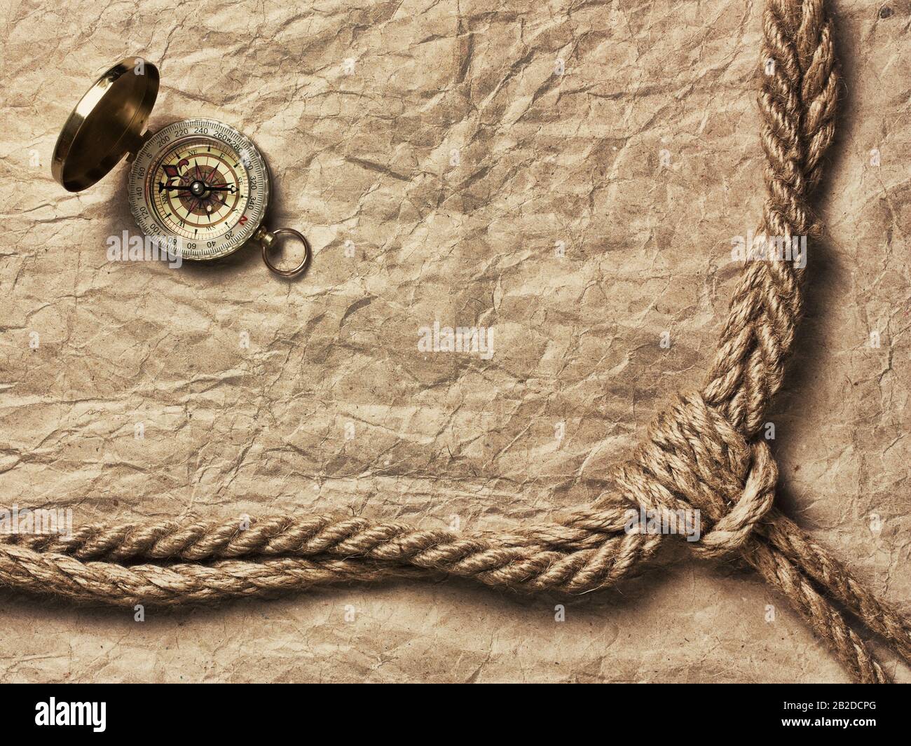compass, old paper and rope, still-life Stock Photo - Alamy