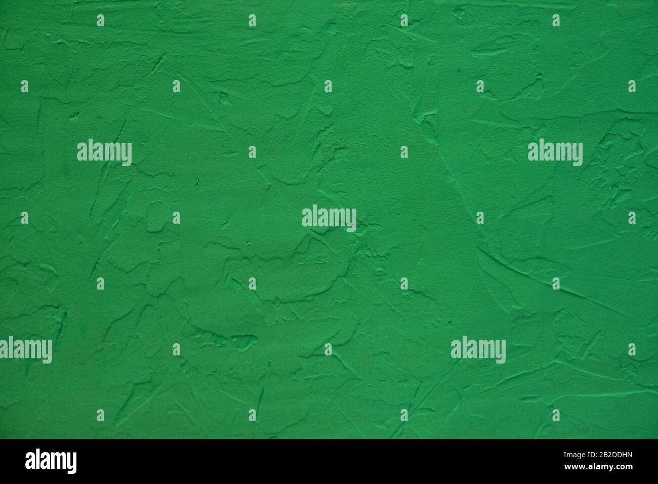 A stone wall painted in green color Stock Photo - Alamy