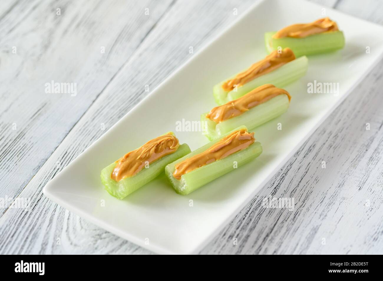 Peanut butter spread on celery hi-res stock photography and images - Alamy