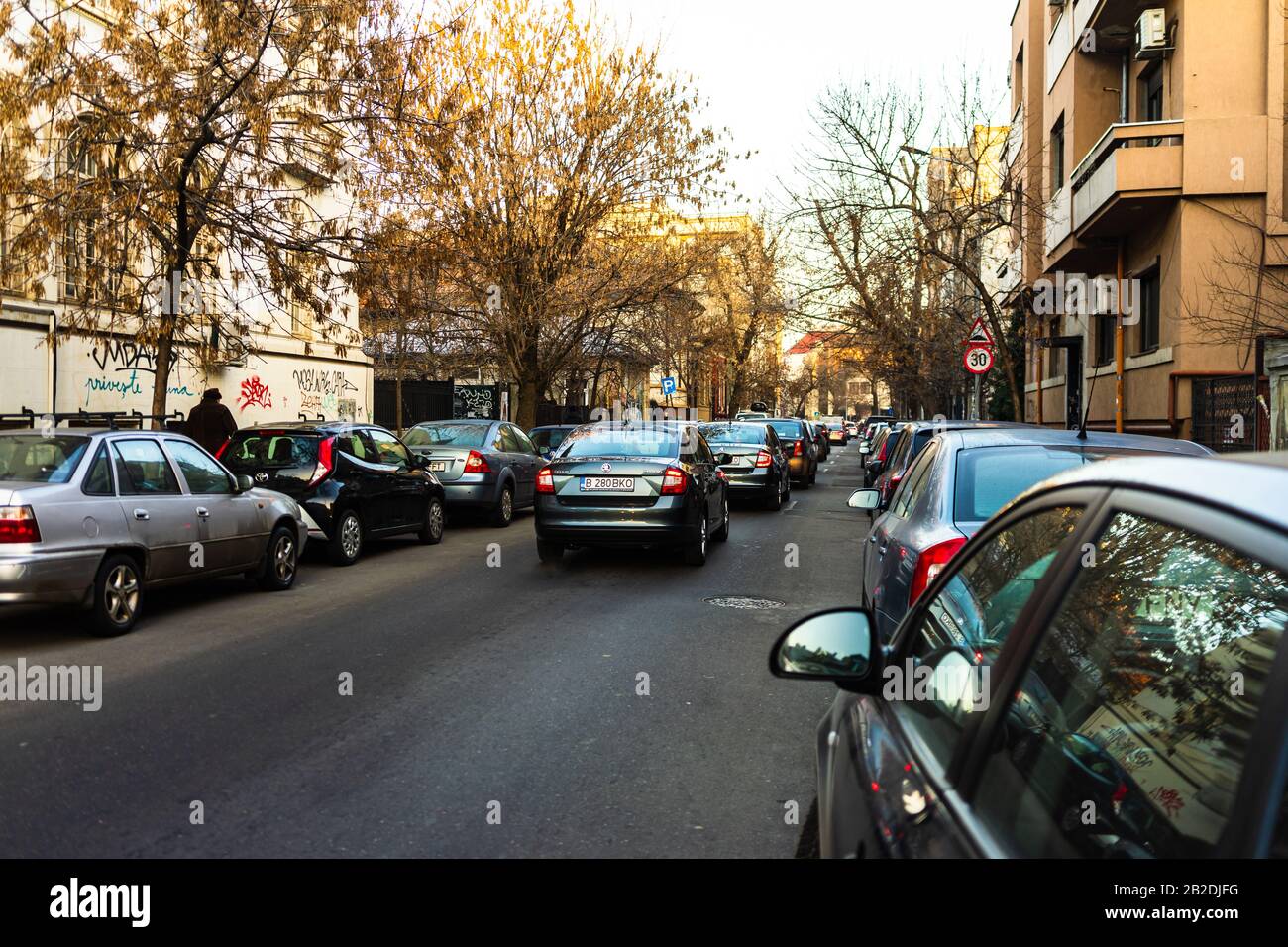 Car traffic at rush hour in downtown area of the city. Car pollution ...