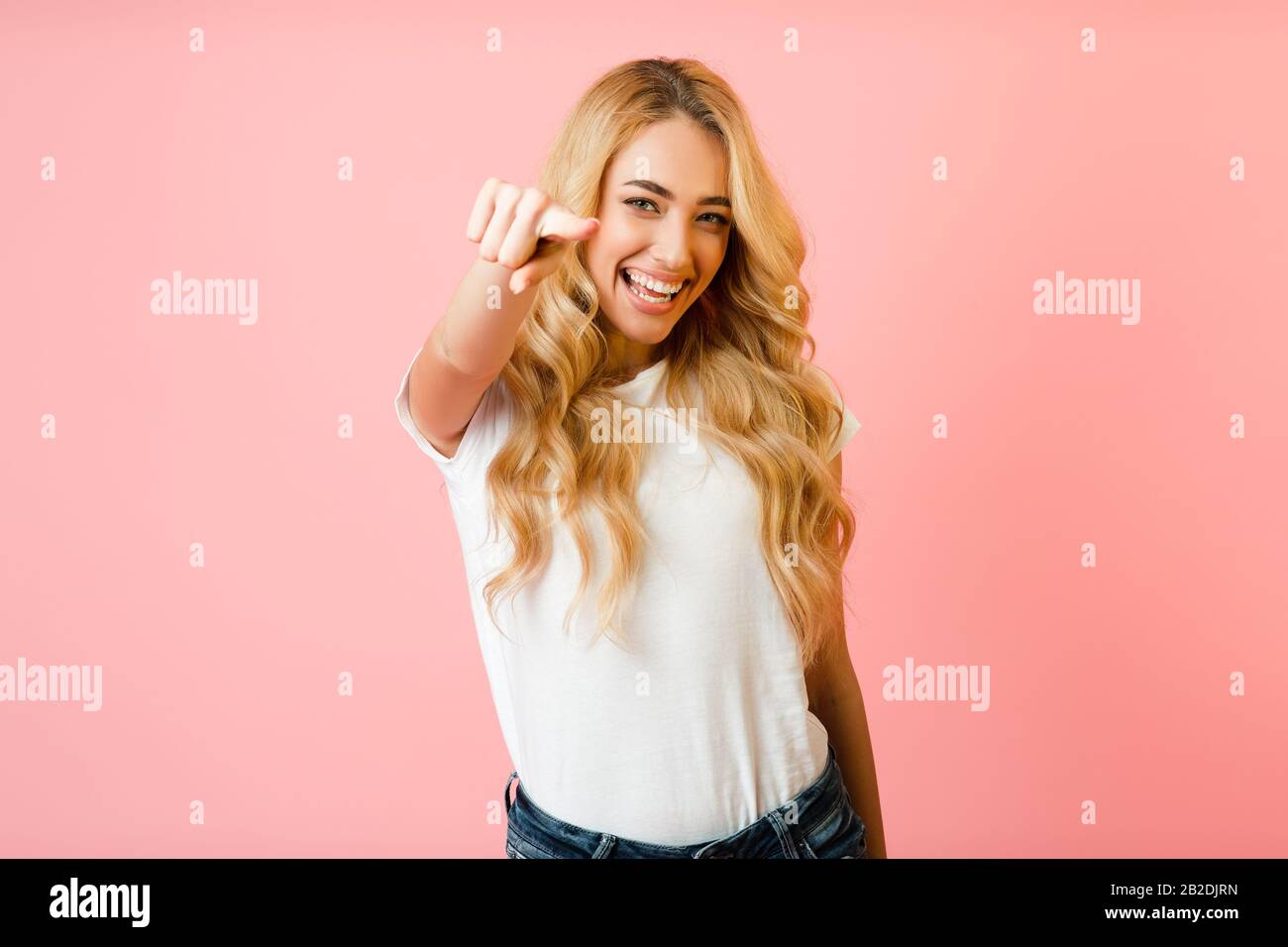 Gotcha! Joyful woman pointing finger at camera Stock Photo - Alamy