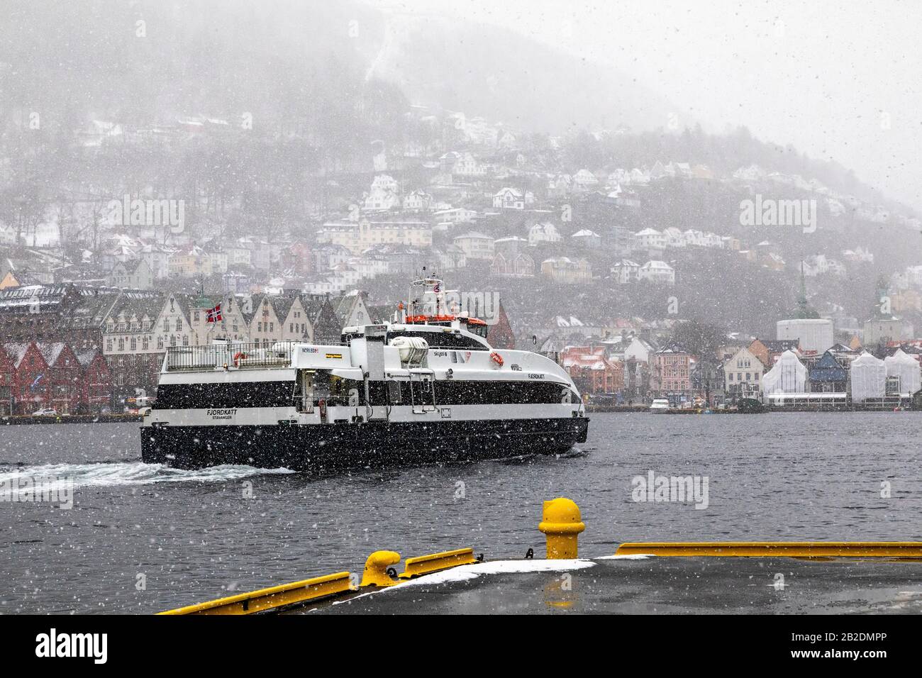 Winter in Bergen, Norway. Snowing heavily. View from the old port of ...