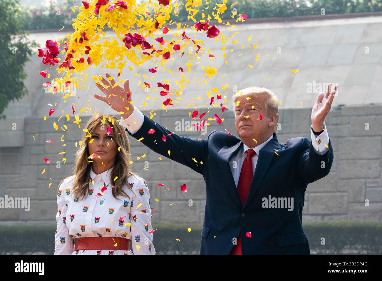 U.S. President Donald Trump and First Lady Melania Trump scatter flower ...