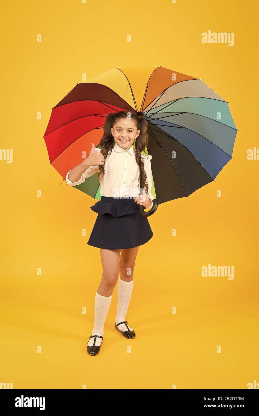 Everything under control. Fancy schoolgirl. Girl with umbrella. Rainy day. Happy childhood ...