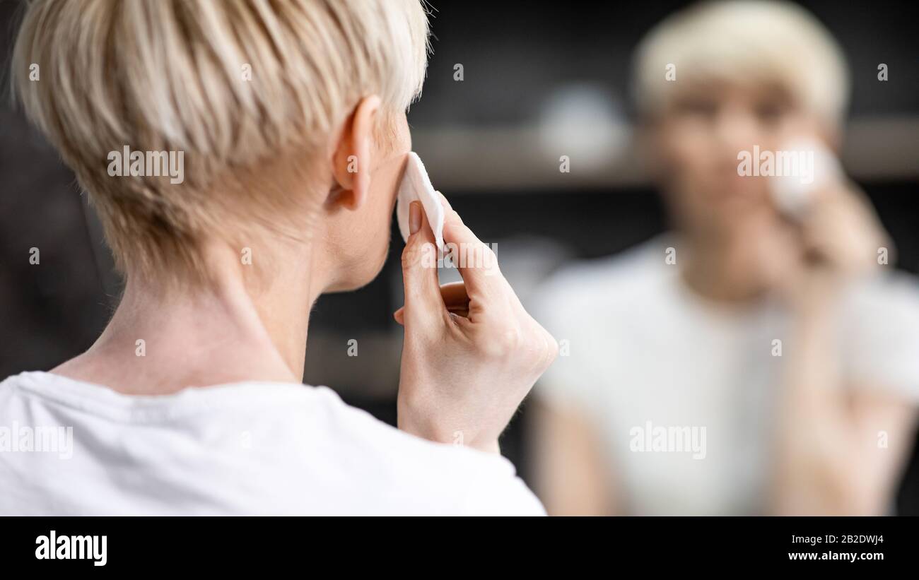 Unrecognizable Woman Using Cotton Pads In Bathroom Indoor, Back-View ...