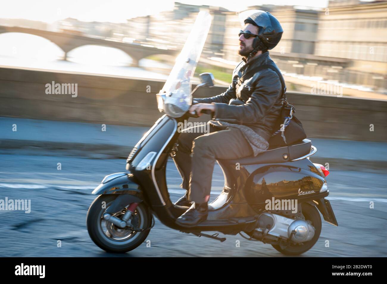 Man and italian scooter vespa hi-res stock photography and images - Alamy